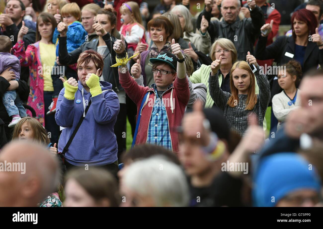 Onlookers give a thumbs up sign as the funeral cortege for Stephen ...