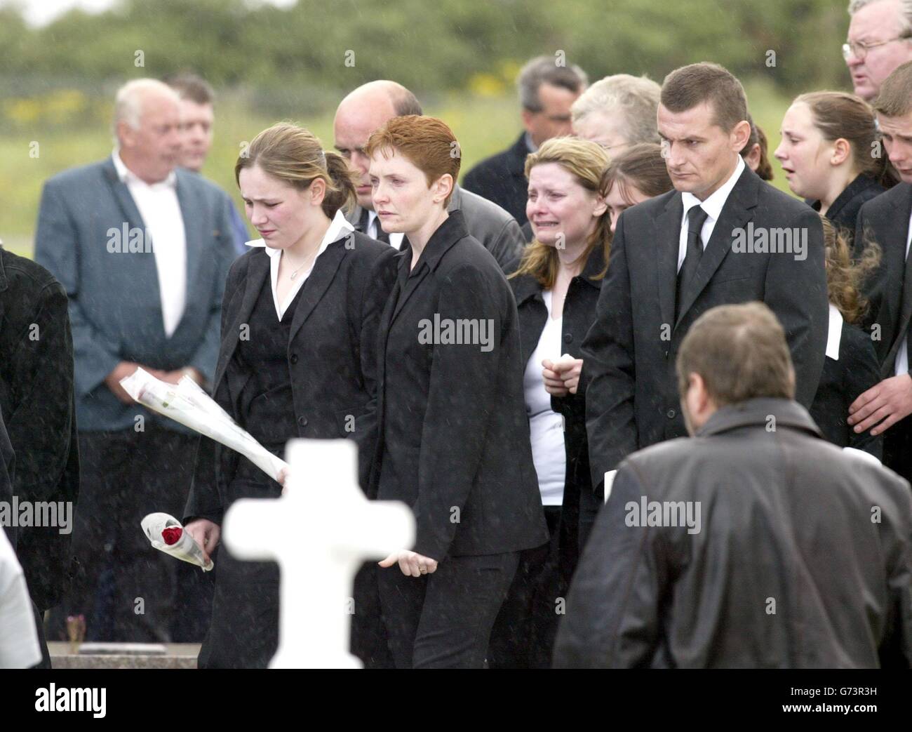 The family of Ms Dolores McCrea, including her four daughters, walk ...