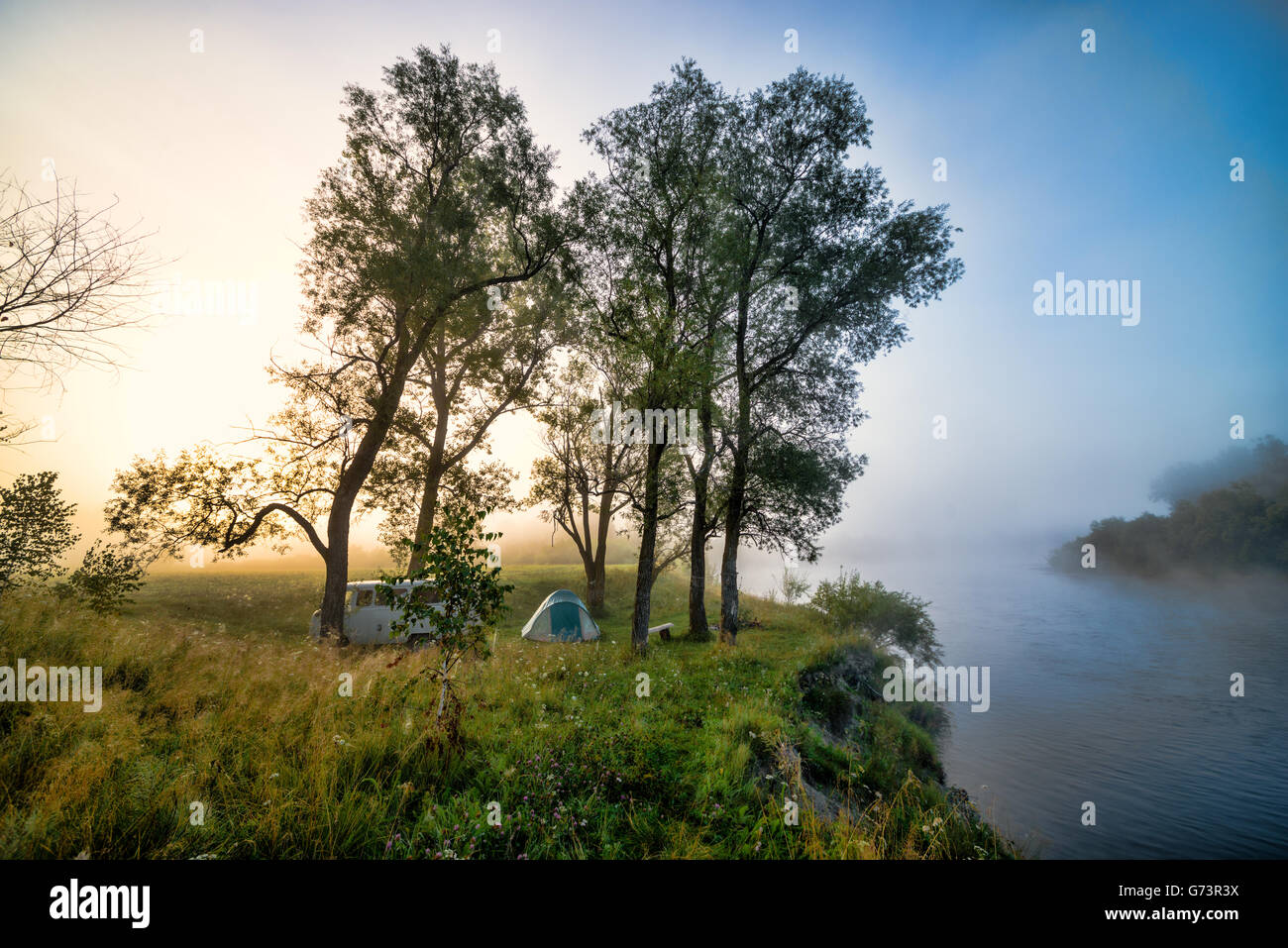 Camping tent on river bank Stock Photo - Alamy