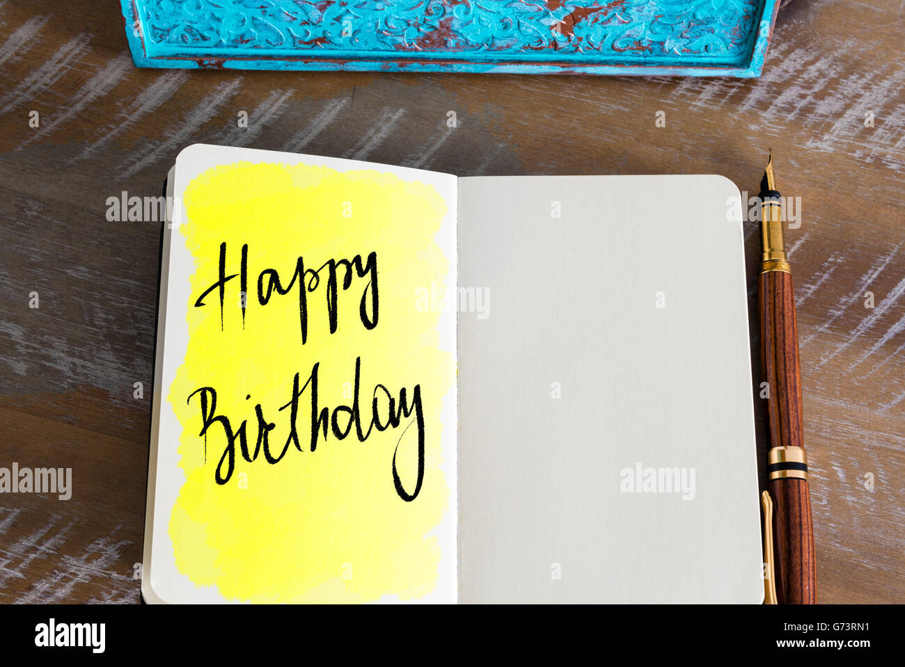 Greeting Happy Birthday handwritten on notebook Stock Photo - Alamy