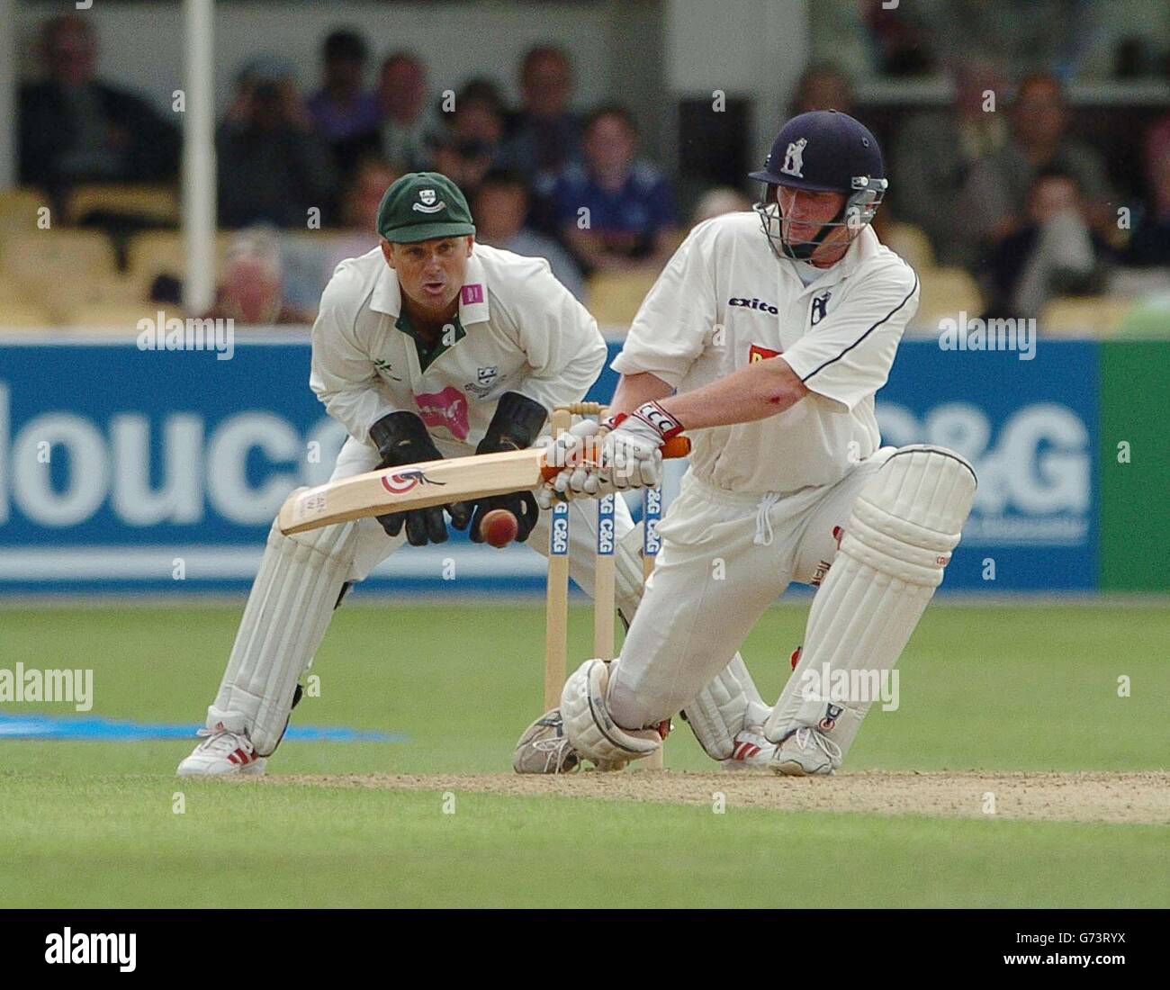 Worcestershire batsman Dougie Brown plays the sweep but is trapped LBW ...