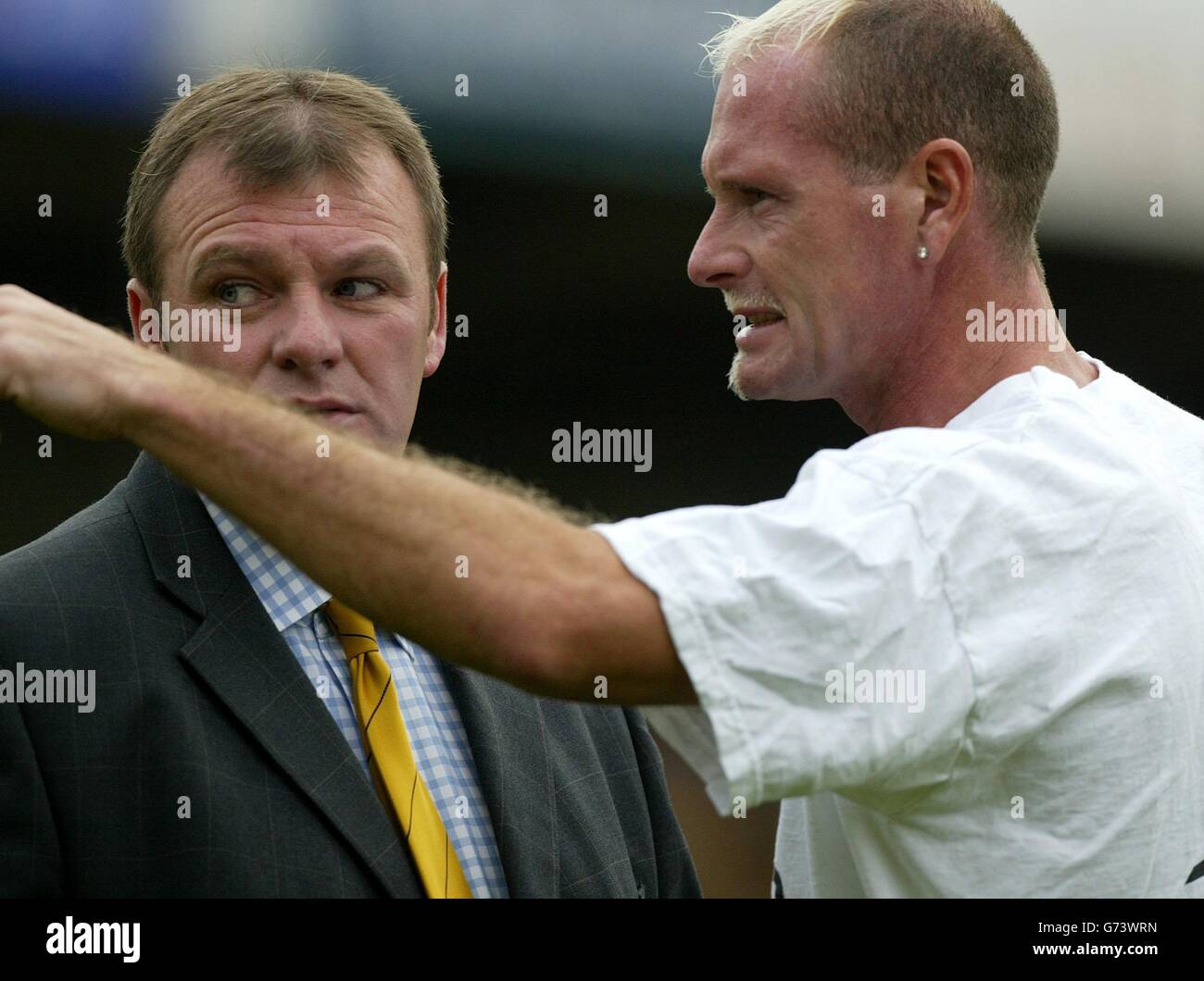 Former England international footballer Paul Gascoigne talks with ...