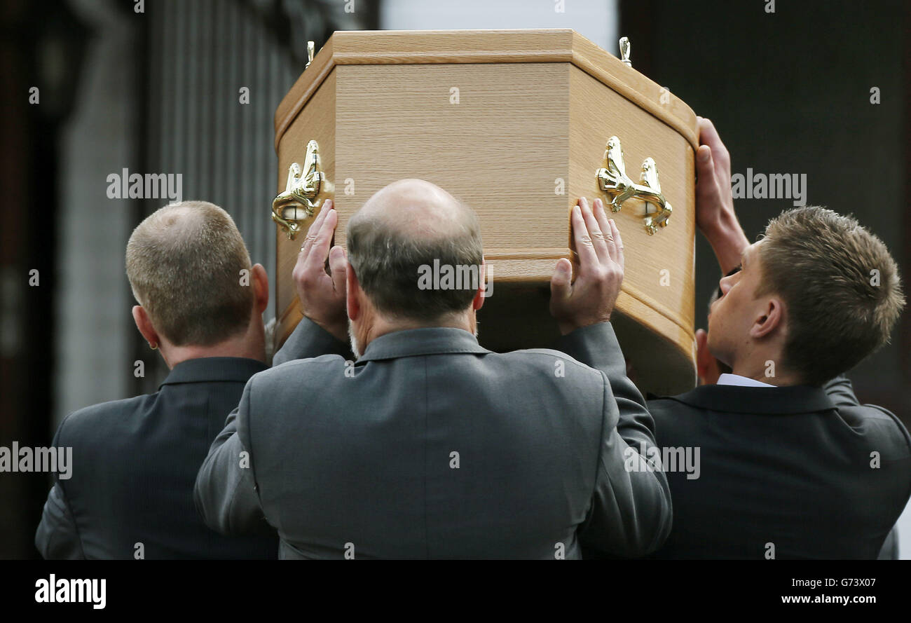 Funeral director employees carry the coffin of Elizabeth Allan, known ...