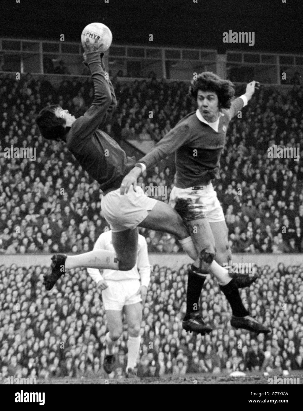 Leeds goalie David Harvey (left) gets the ball safely away during the ...