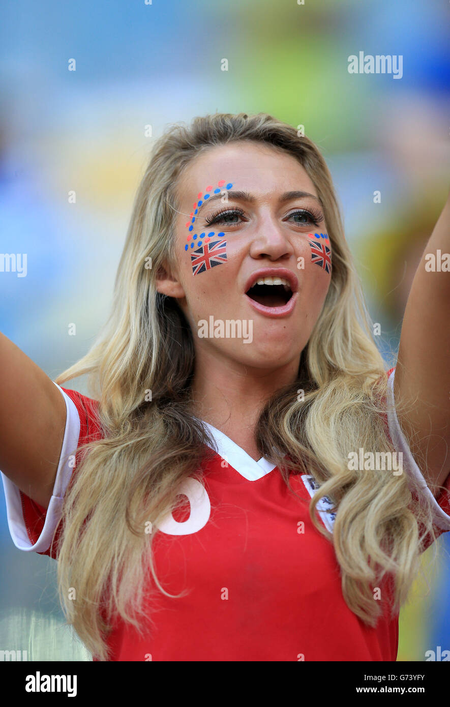 An England fan shows support for her team before kick-off in the FIFA ...