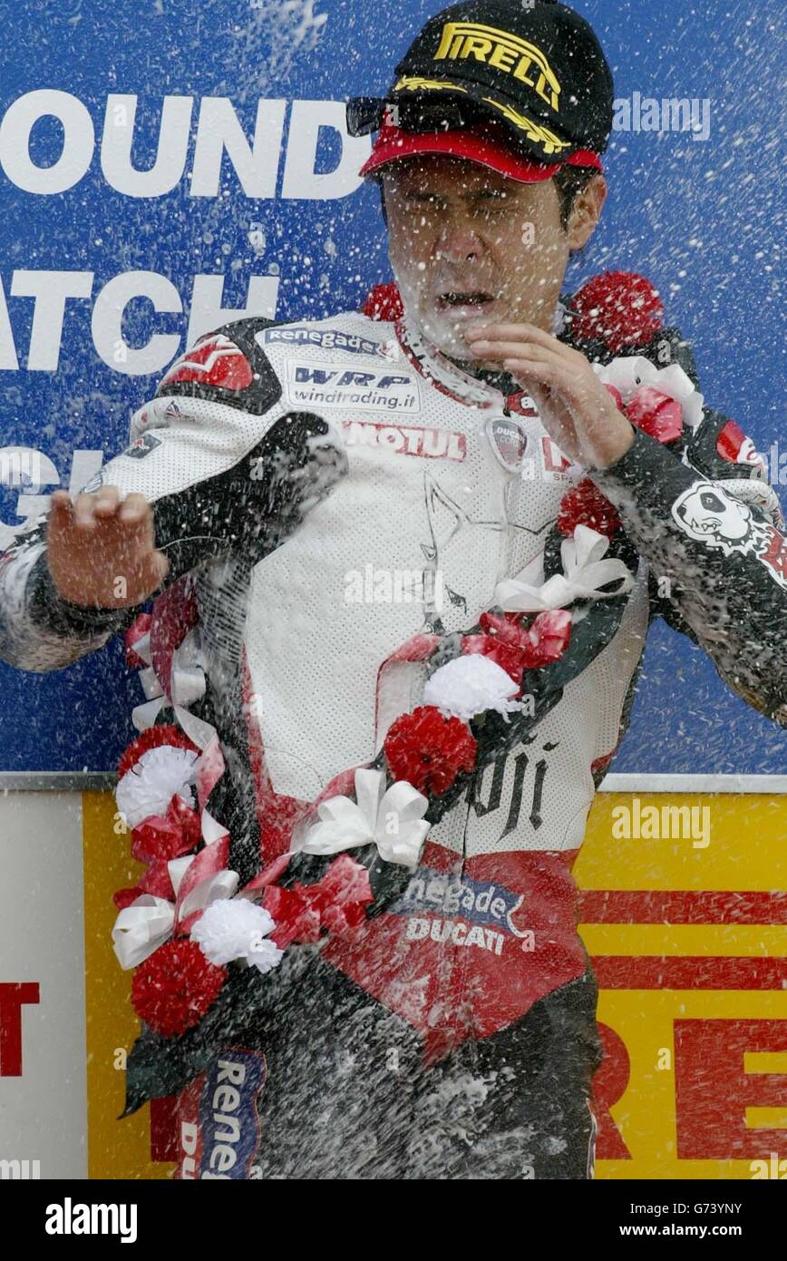 Noriyuki Haga of Japan is covered in champagne after winning the first ...