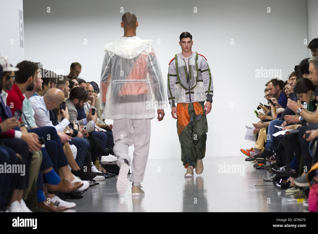 Models wear designs in the Christopher Raeburn catwalk show during ...