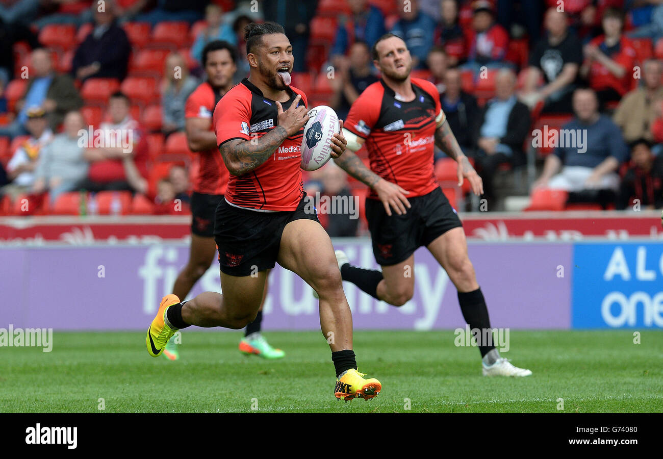 Salford Red Devils' Junior Sa'u breaks away for his third try against ...