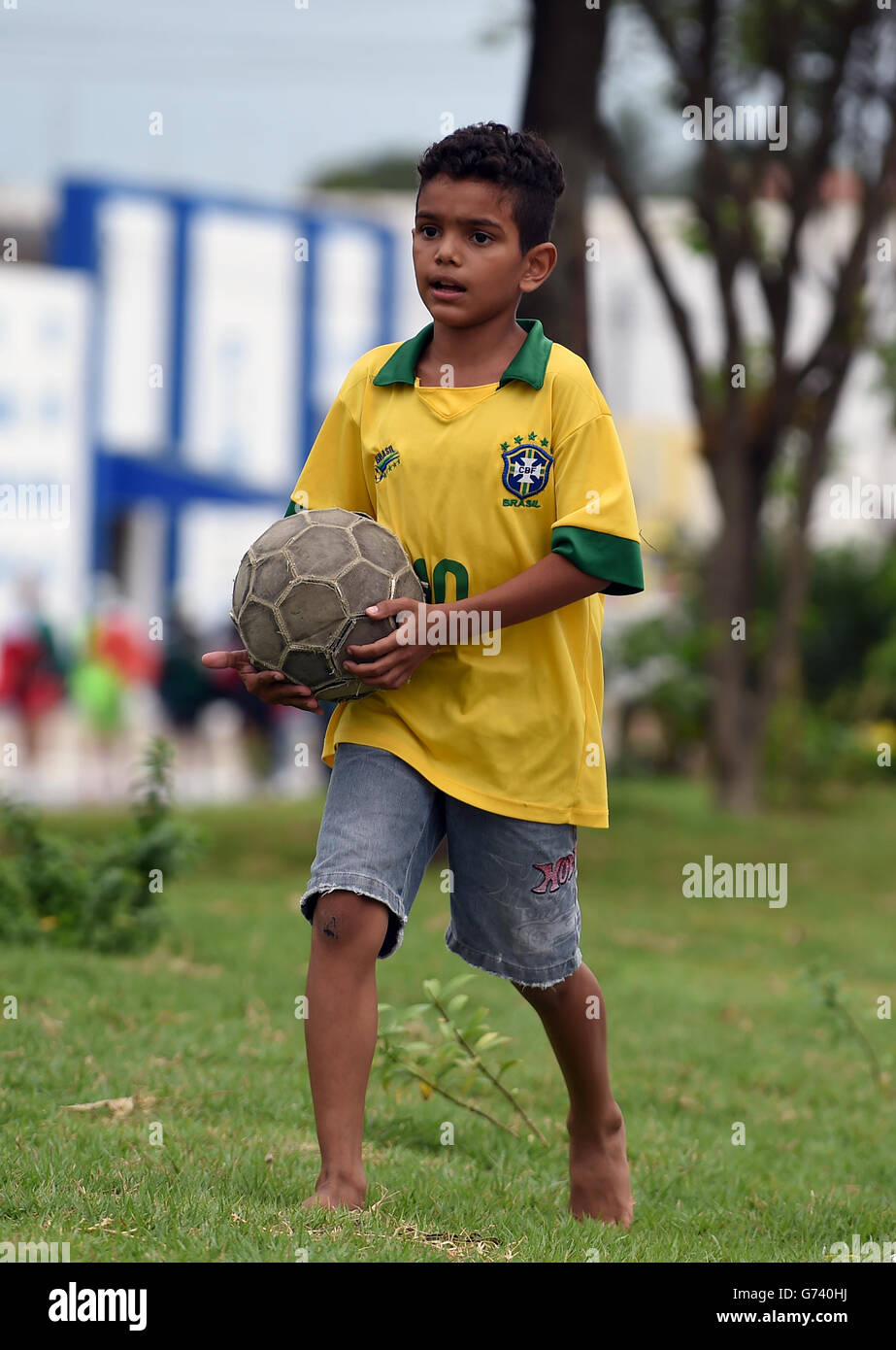 Kid playing soccer brazil hi-res stock photography and images - Alamy