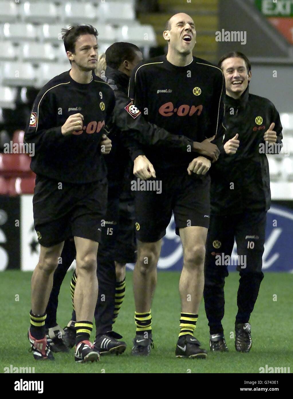 Borussia Dortmund Jan Koller (centre) shares a joke with his players ...