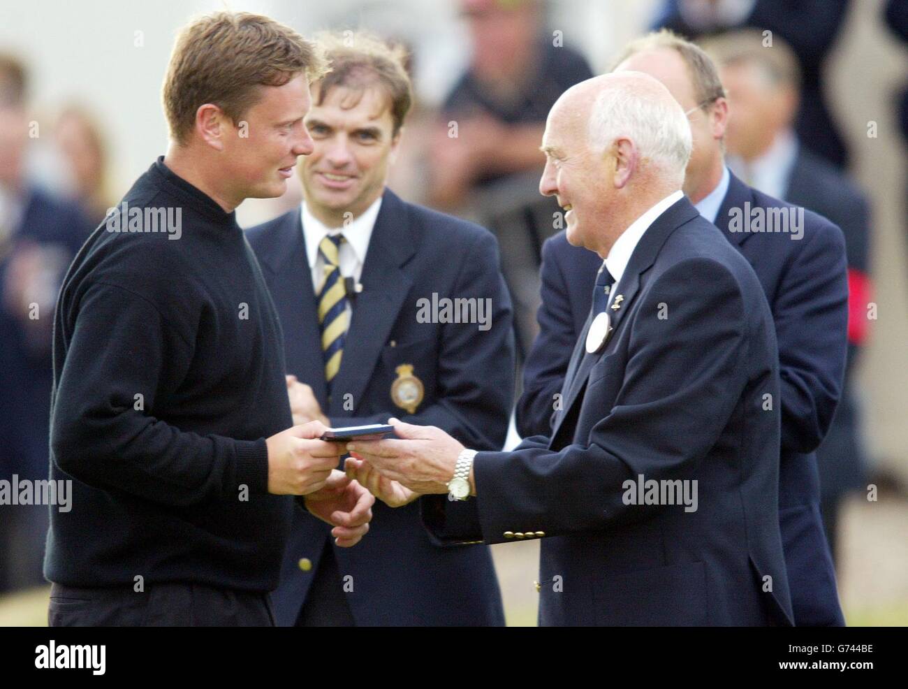 Scotland's Stuart Wilson (left) receives his medal for highest placed ...