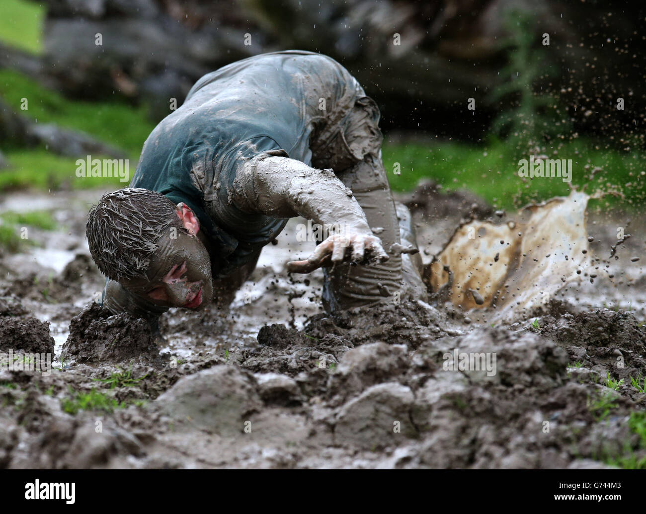 Blair Drummond Safari Park keeper Graeme Alexander crawls through ...