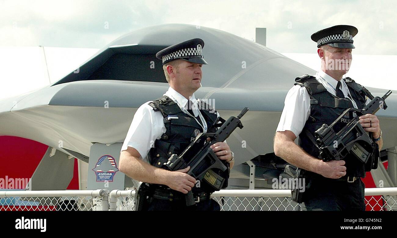 Hampshire Police firearms officers pass a J-UCAS X-47B unmanned combat ...