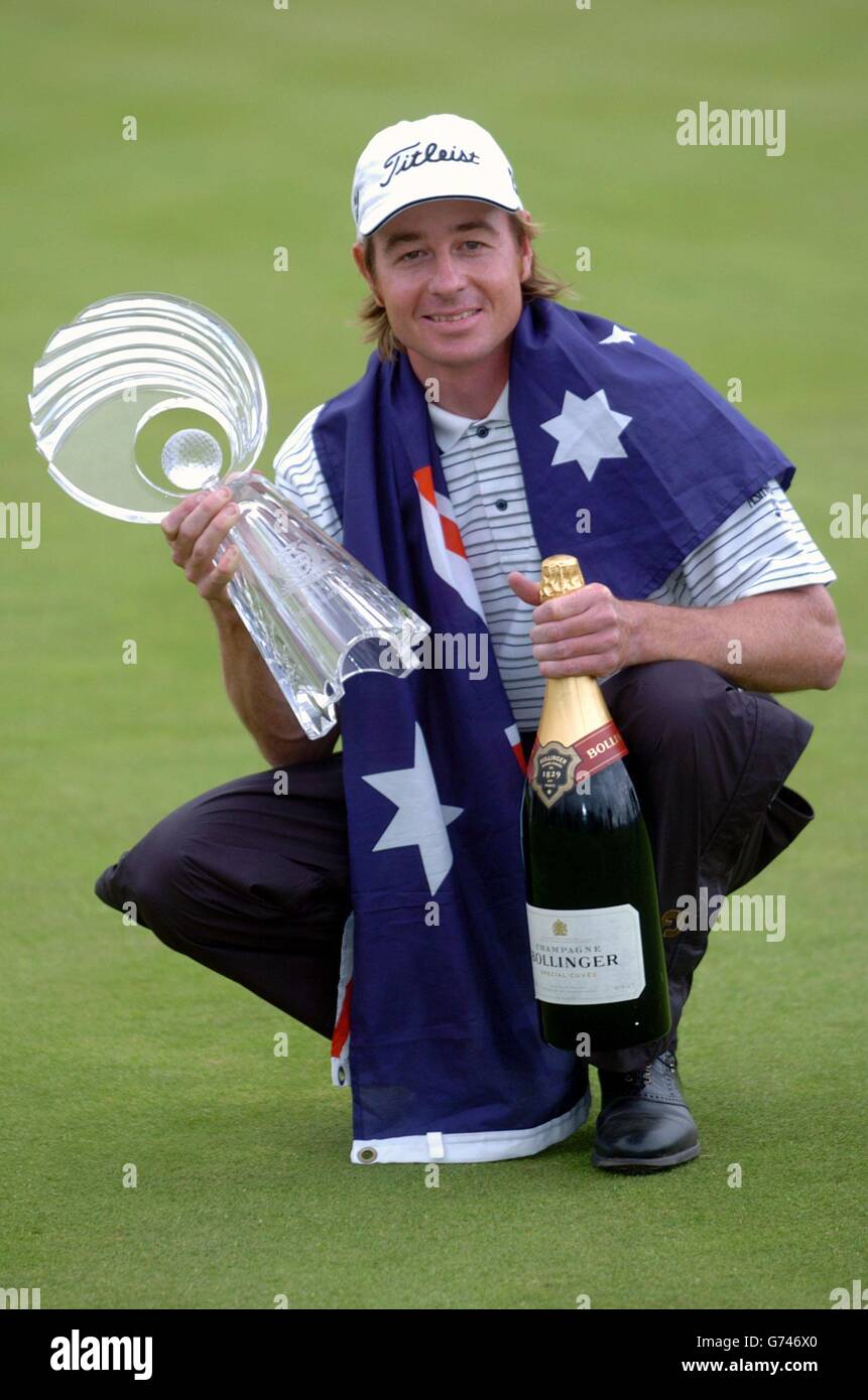 Australia's Brett Rumford holds his trophy after winning the Nissan ...