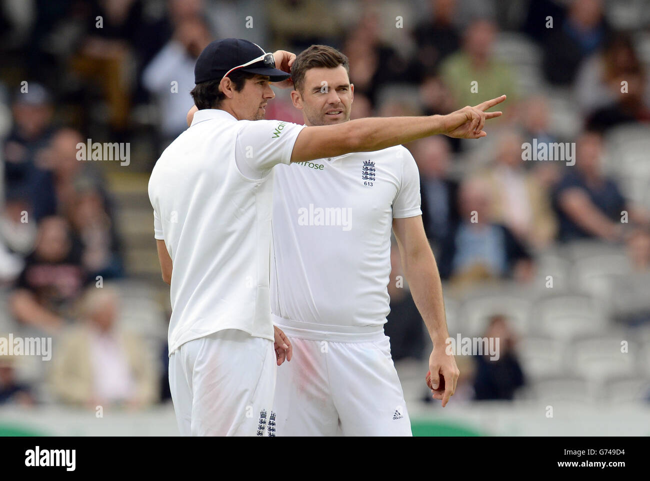 England's Alastair Cook speaks with James Anderson during day five of ...