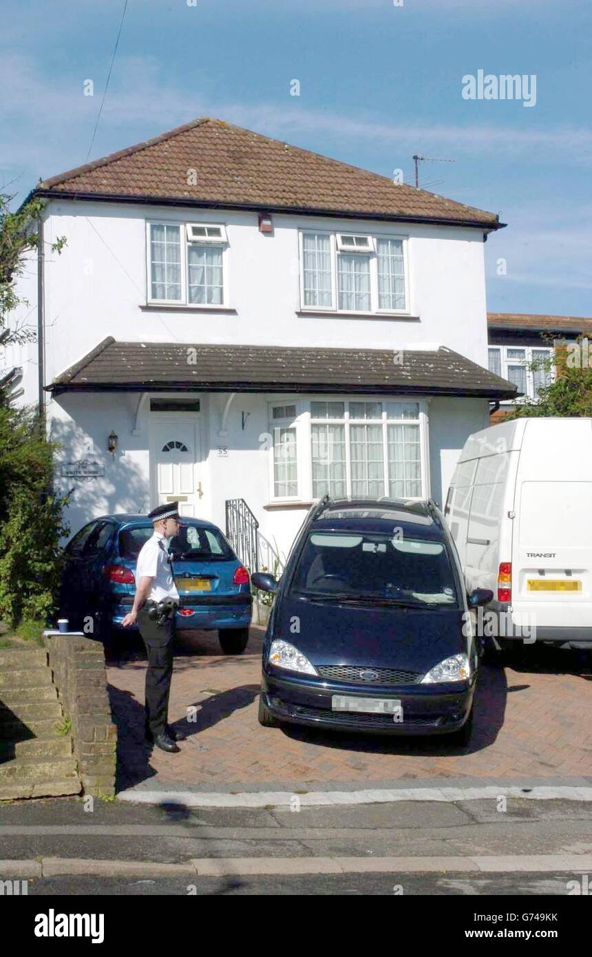 Police officer outside suspects house Stock Photo - Alamy