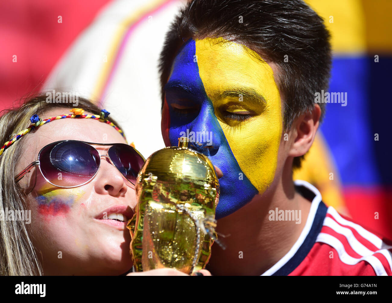 Columbia fans kiss replica world cup trophy kick off hi-res stock ...