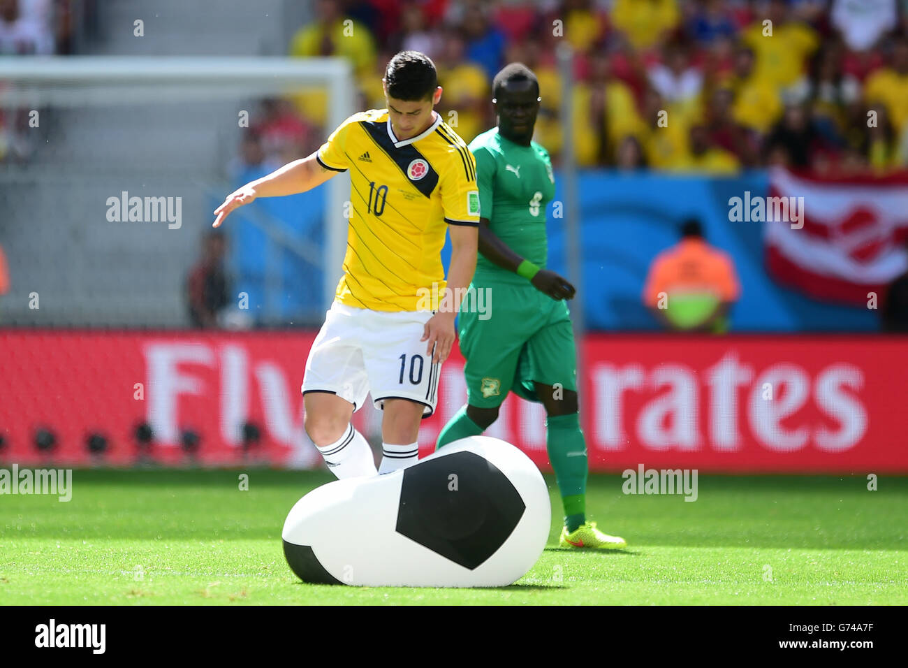 Colombia's James Rodriguez and Ivory Coast's Cheick Tiote look at the ...