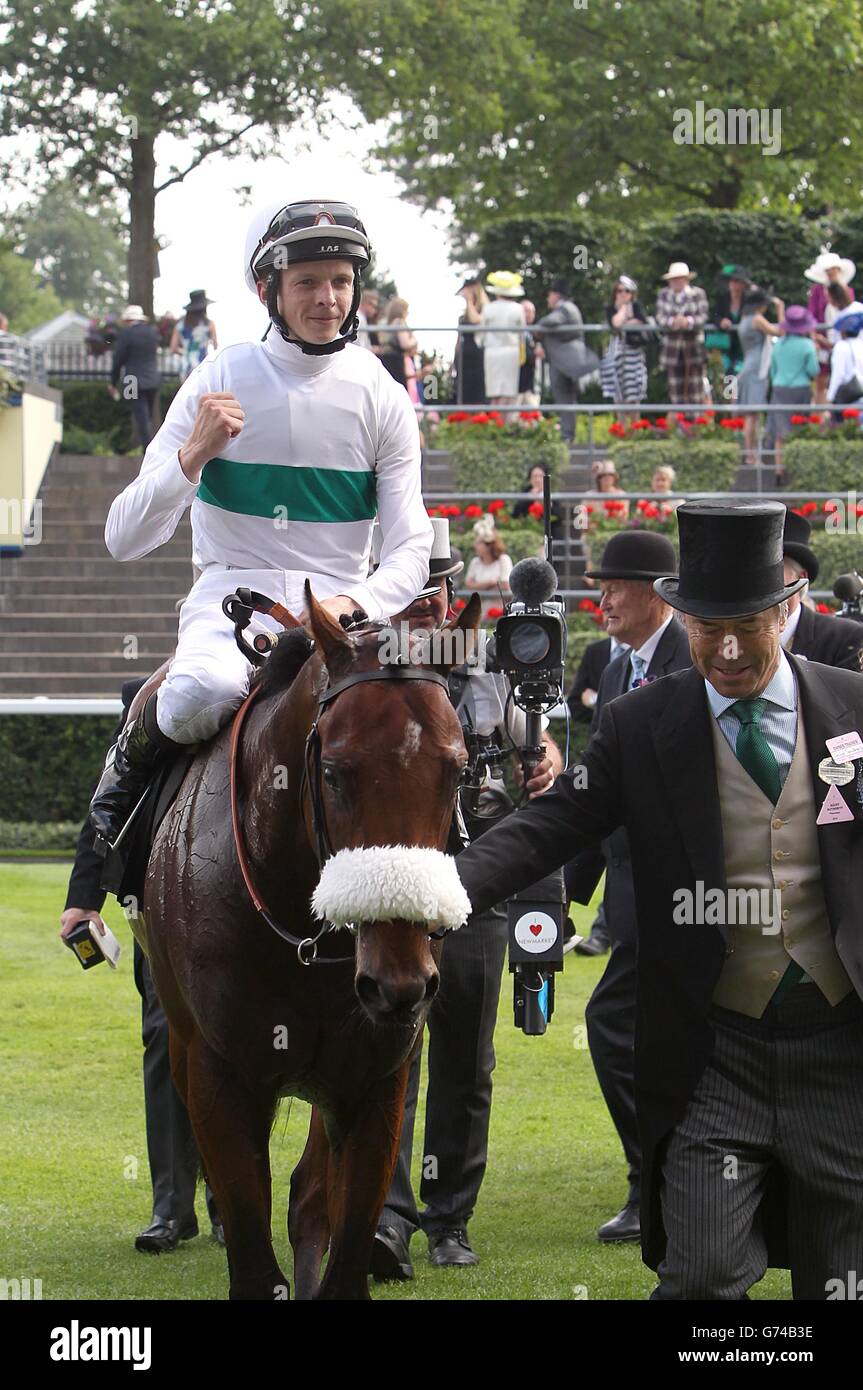 Born In Bombay and jockey David Probert are escorted into the winners ...