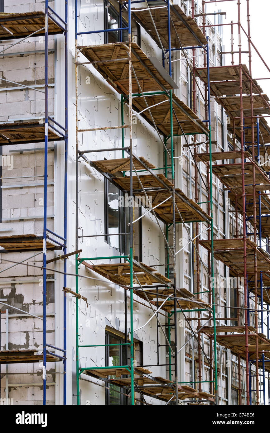 Incomplete building under construction with temporary scaffolding Stock ...
