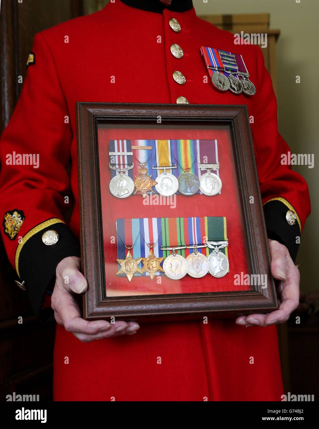 Chelsea Pensioner Michael Funnell poses with his father medals as ...