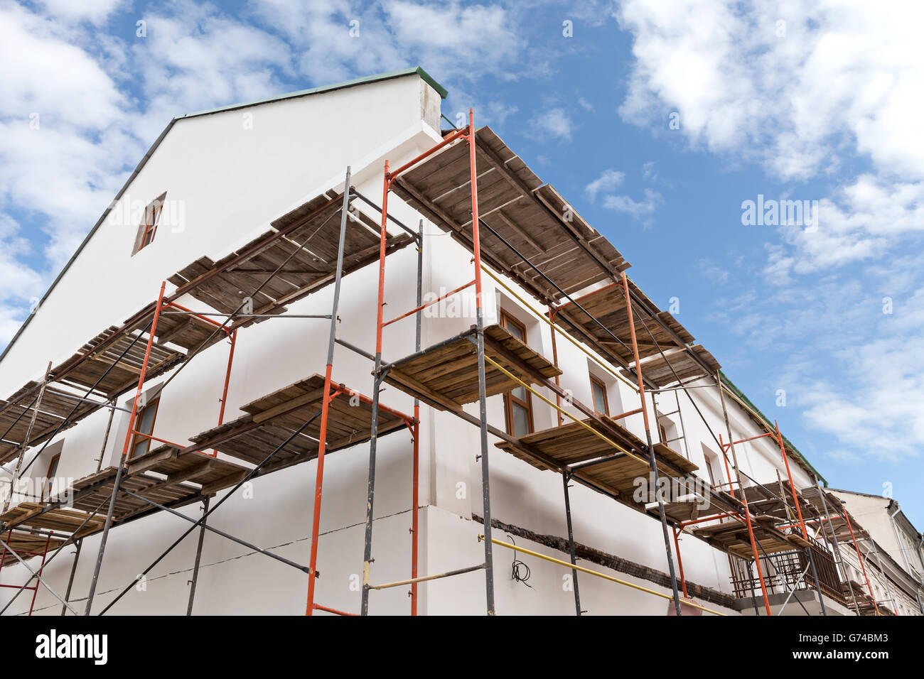 Scaffolding covering a facade of an old building under renovation Stock ...