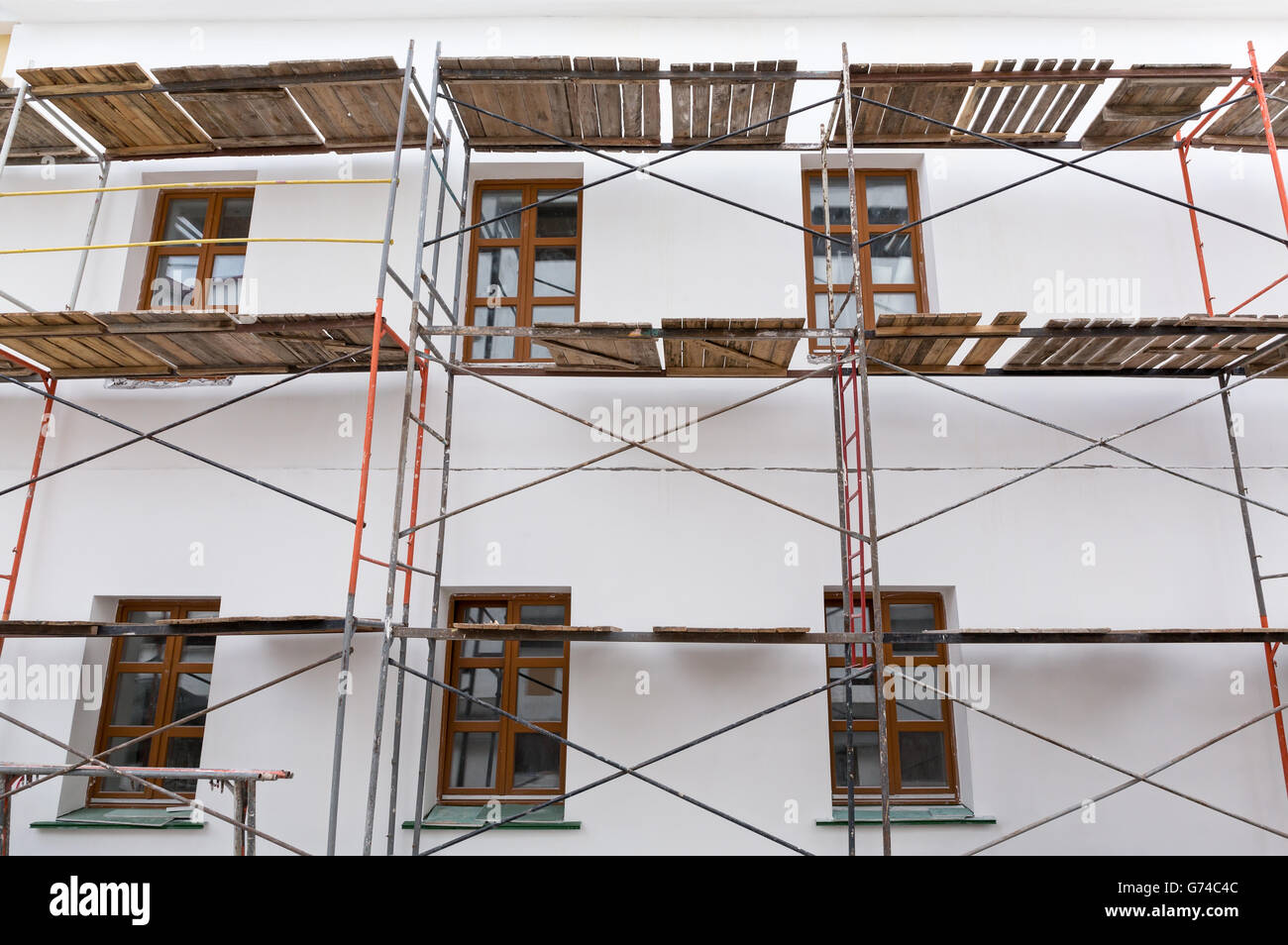 Plaster wall of building under reconstruction with scaffolding Stock ...