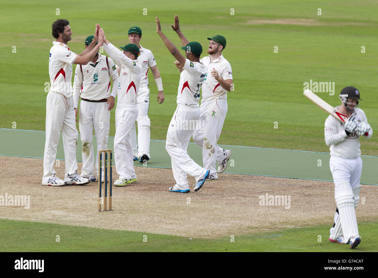 Surrey batsman Gareth Batty leaves the field after being caught behind ...