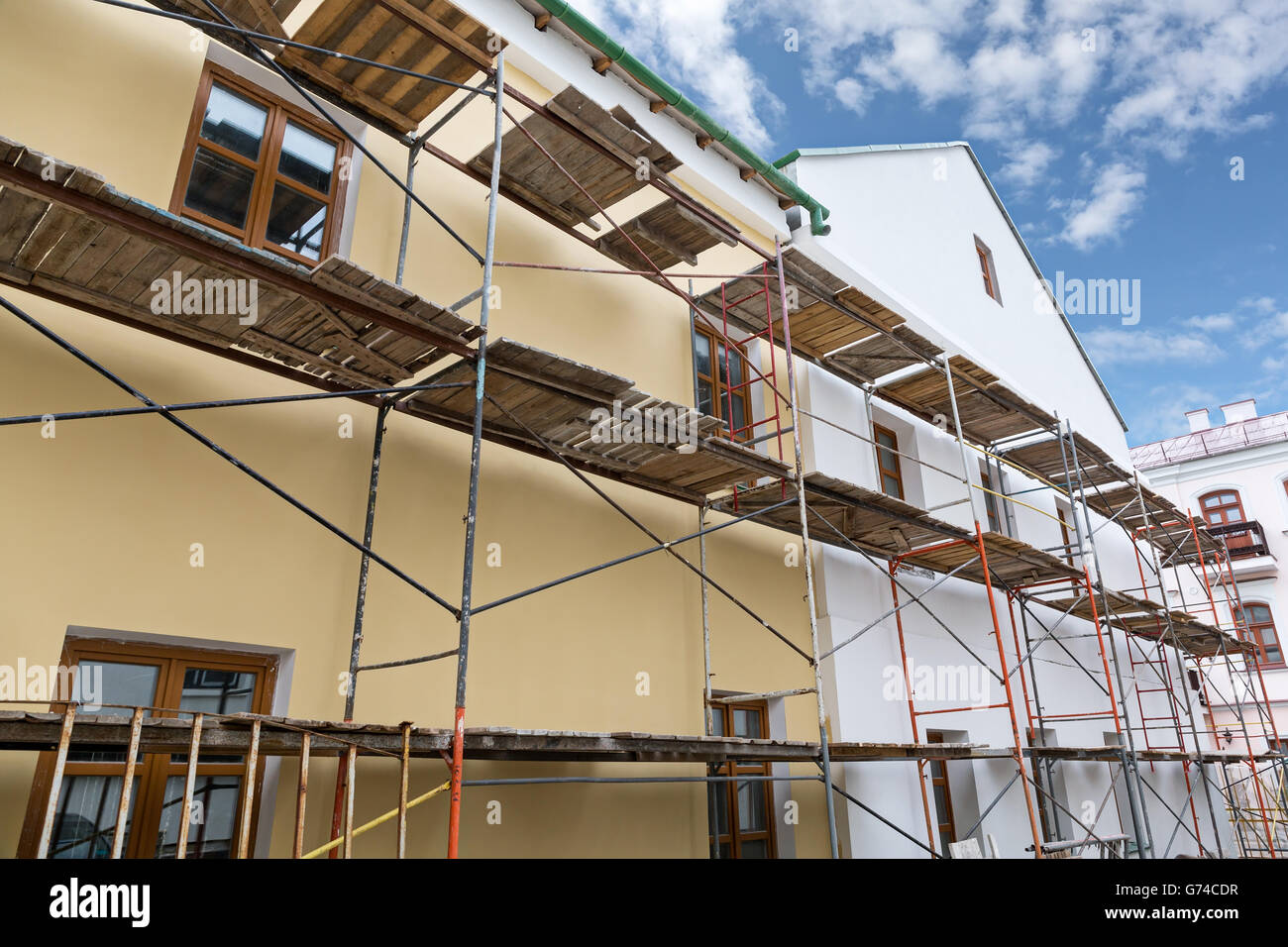 Old building facade with scaffolding under reconstruction Stock Photo ...