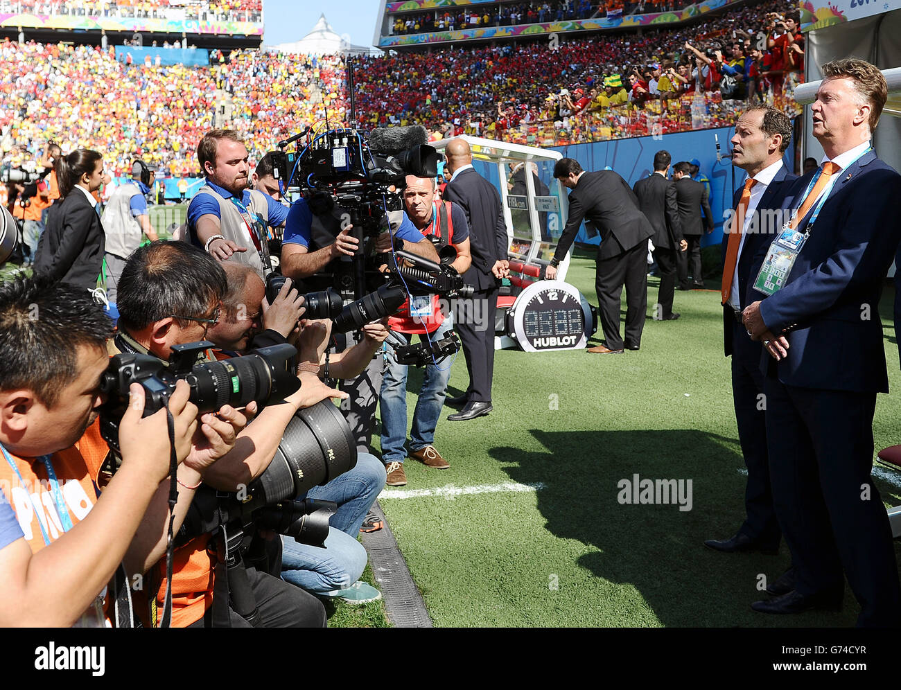 Netherlands manager Louis van Gaal (right) is photographed by members ...