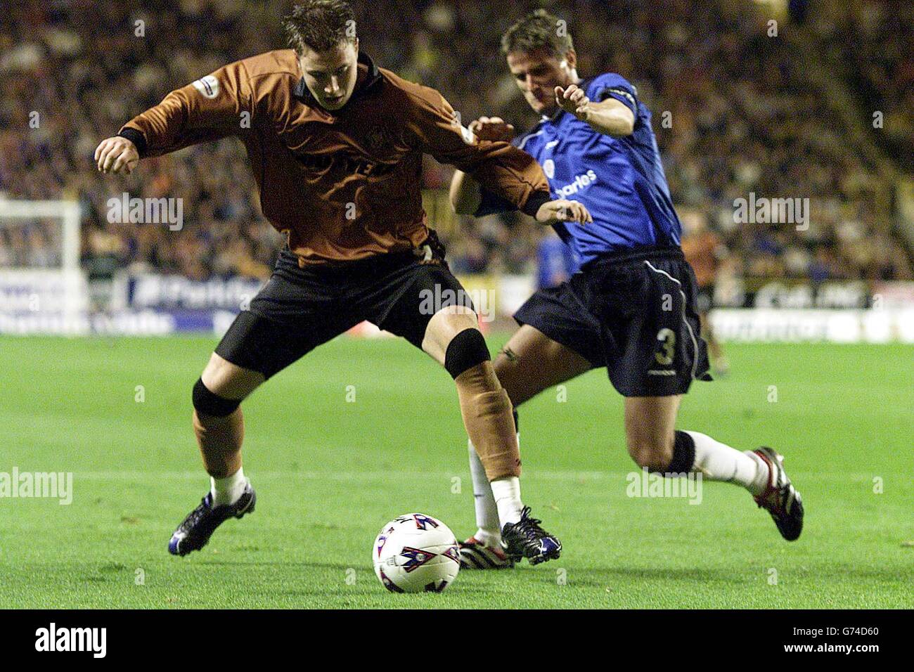 Wolverhampton Wanderers' Adam Proudlock (left) holds off the challenge ...