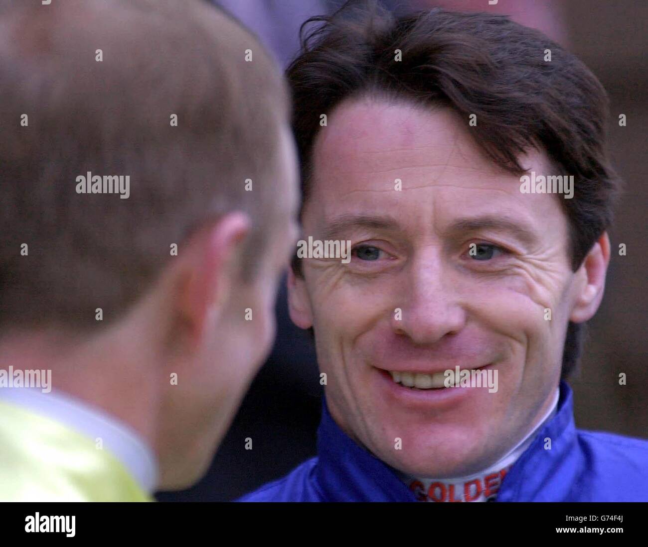 Kieren Fallon (R) receives the trophy for the Flat Jockey's ...