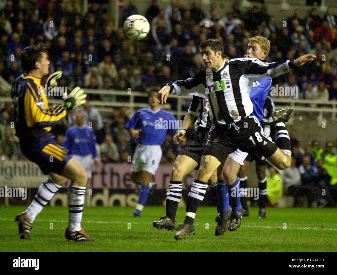 Newcastle's Aaron Hughes heads back to keeper Steve Harper under ...