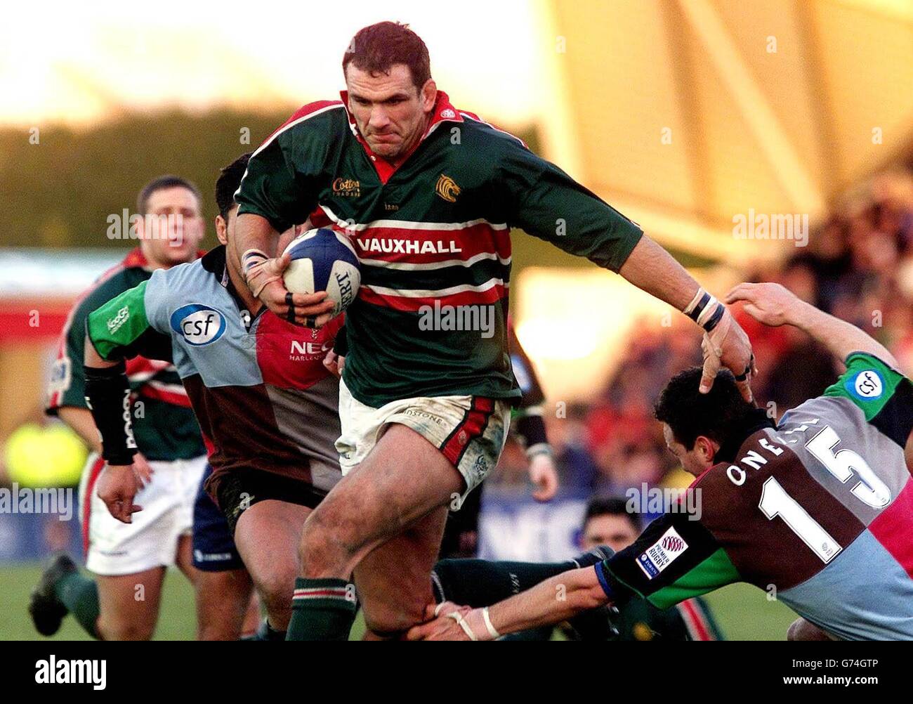 Leicester captain Martin Johnson breaks through the tackle of ...