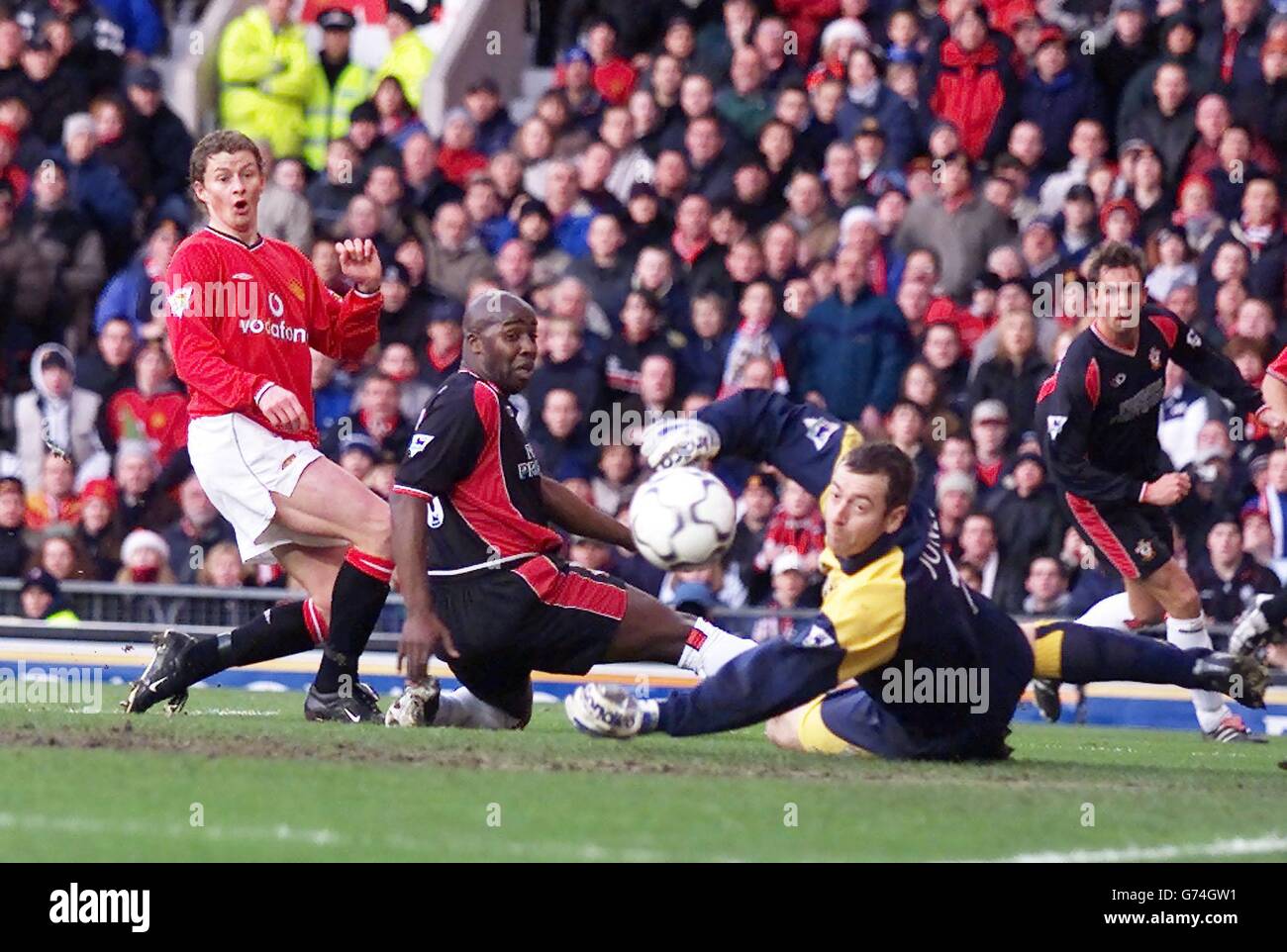 Manchester United's Ole Solskjaer (L) shot is saved by Paul Jones of ...