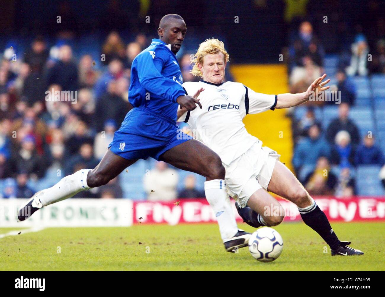 Chelsea's Jimmy Floyd Hasselbaink goes for goal as Bolton's Colin ...