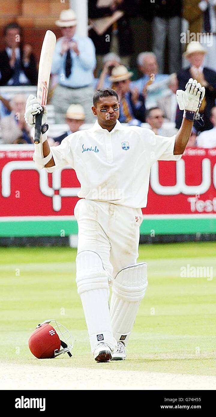 Sport cricket celebrating full length bat raised hi-res stock ...