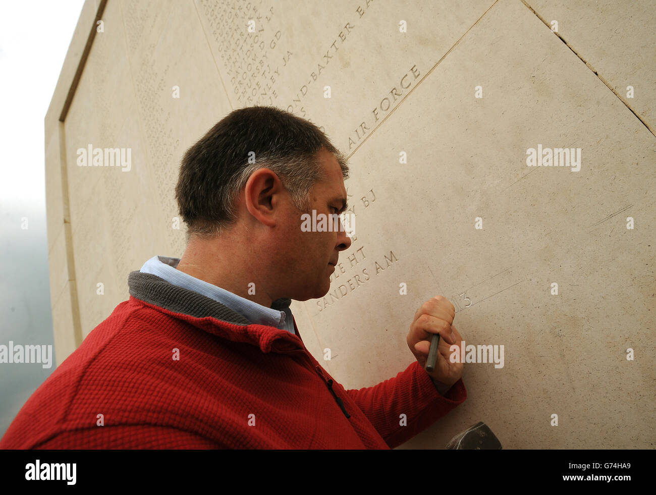 Engraver Nick Hindle engraves the names of UK Armed Forces personnel ...