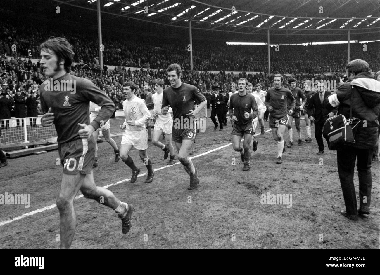 Chelsea and Leeds United players run onto the pitch at Wembley before ...
