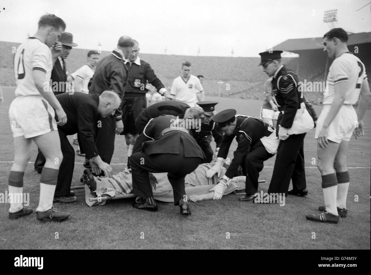 Manchester United's goalkeeper Ray Wood is swathed in blankets and ...