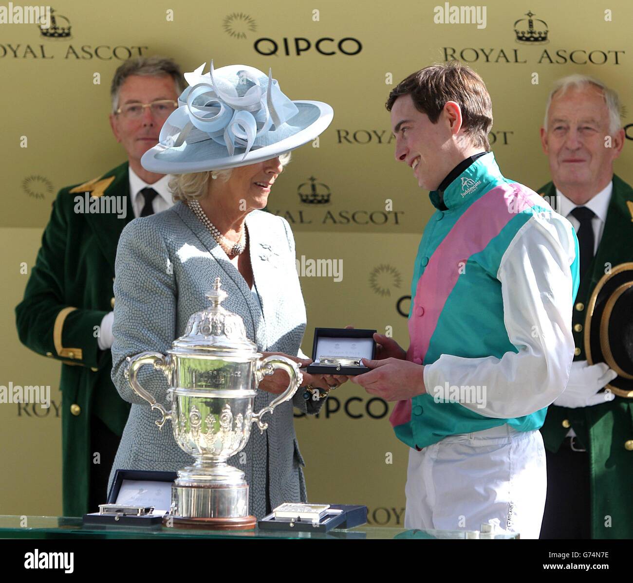 The Duchess of Cornwall presents jockey James Doyle with a trophy after ...