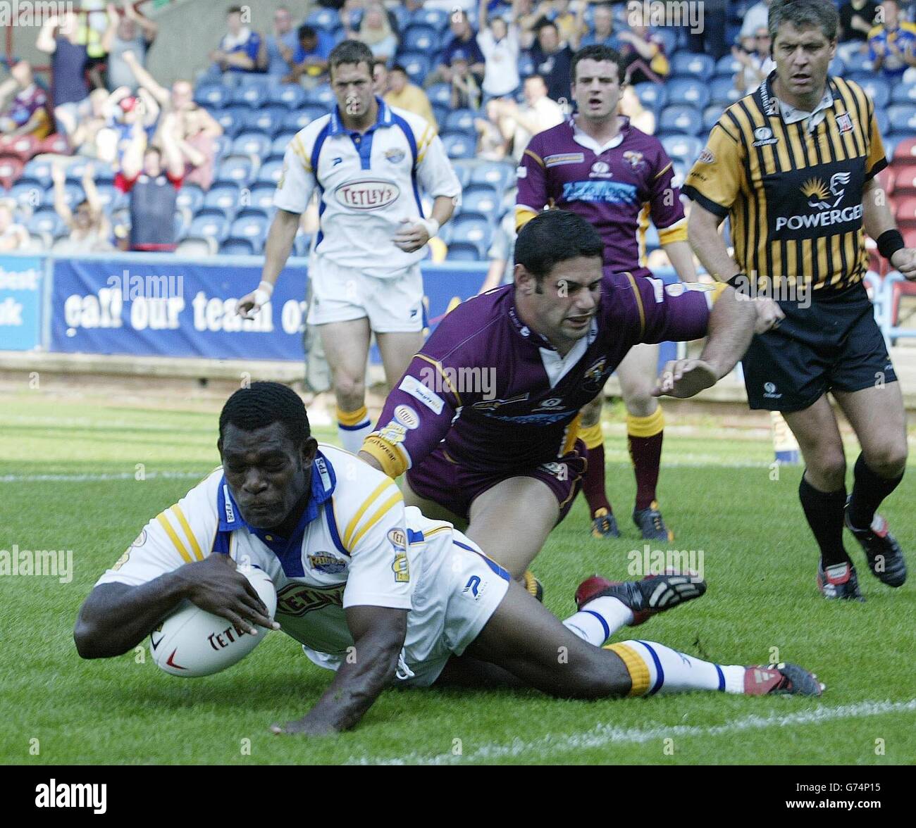 Leeds' Marcus Bai scores his team's second try against Huddersfield ...