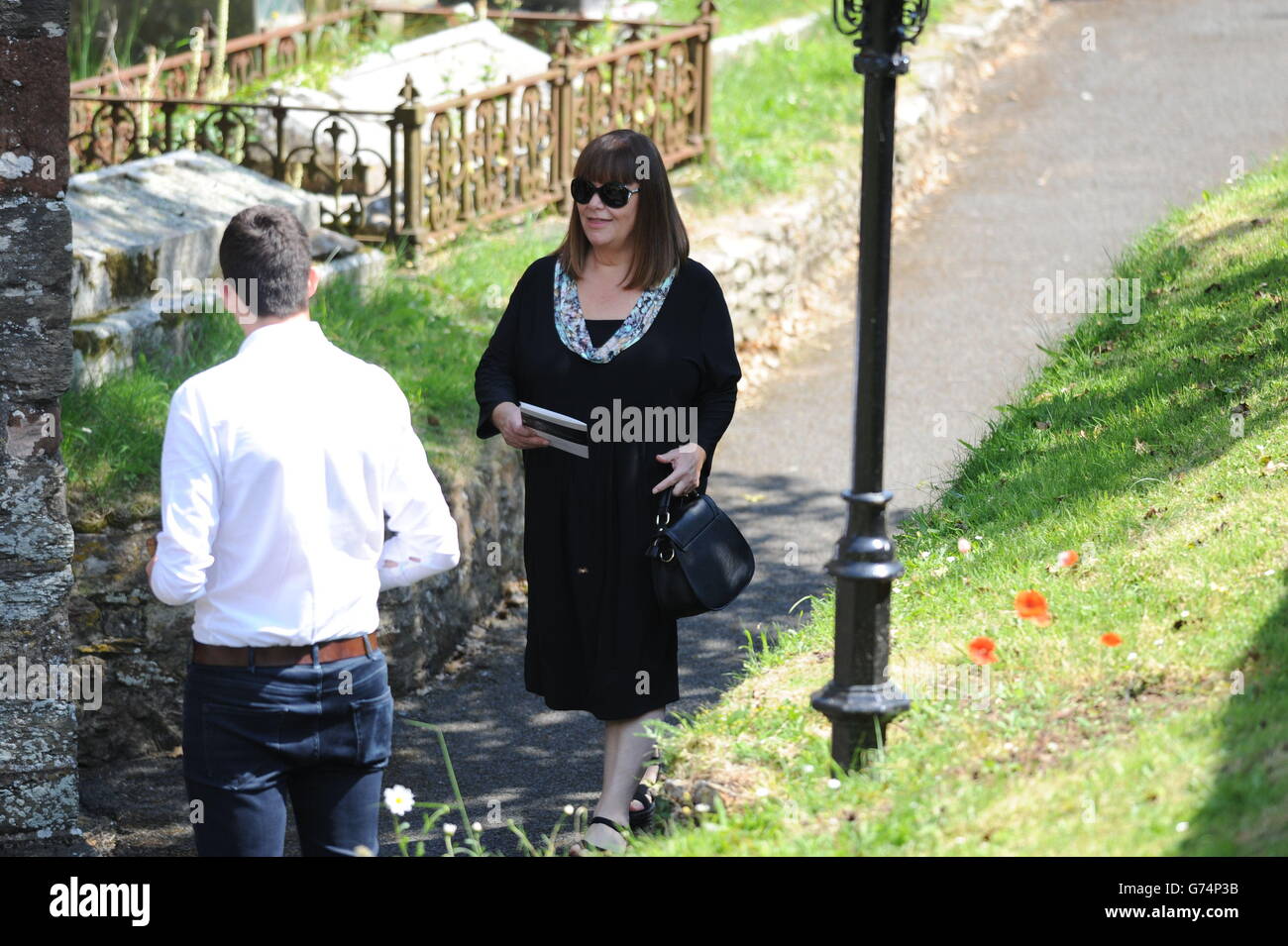 Dawn French arrives for the funeral of Rik Mayall at St George's church ...