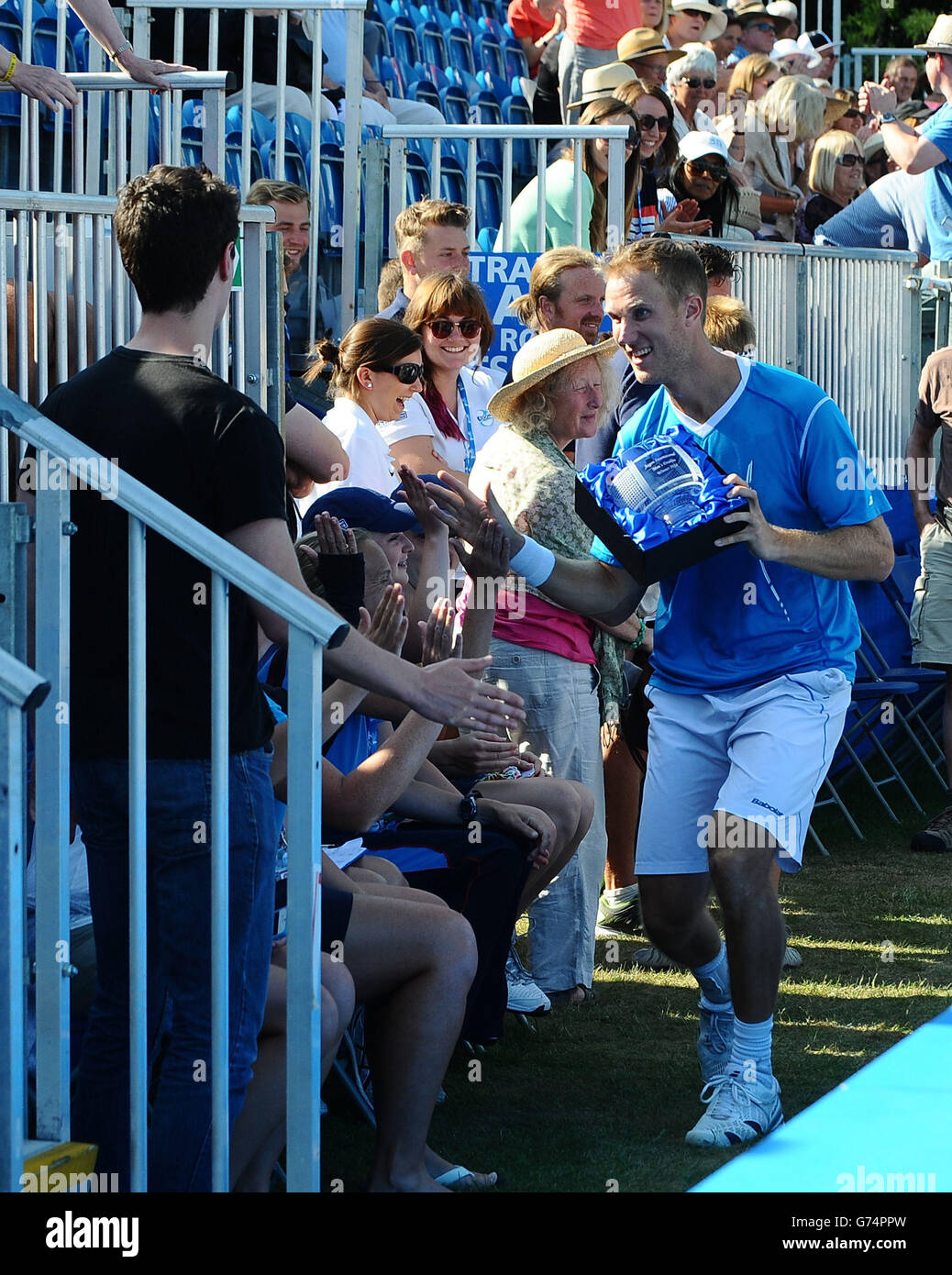 Dominic Inglot celebrates with members of the crowd after winning the ...