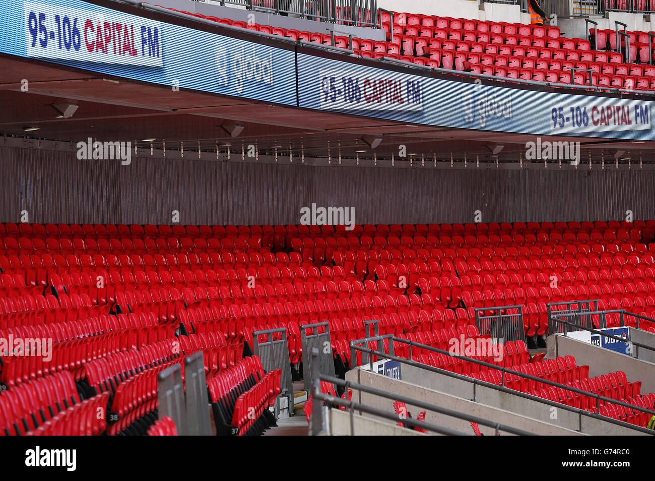 Capital FM branding can be seen on the electronic advertising boards around Wembley Stadium ...