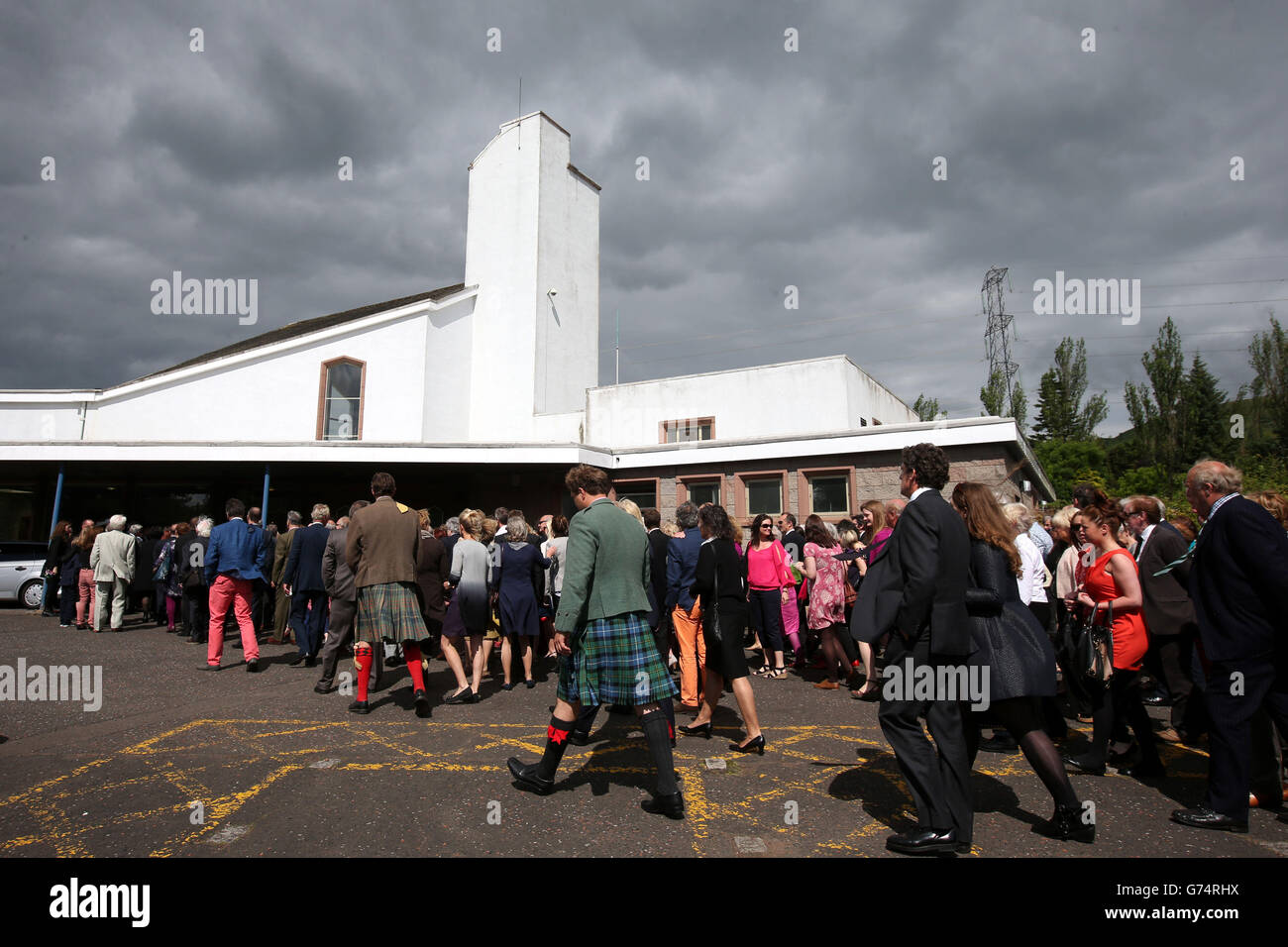 Mourners arrive at the funeral of theatre producer and writer David ...