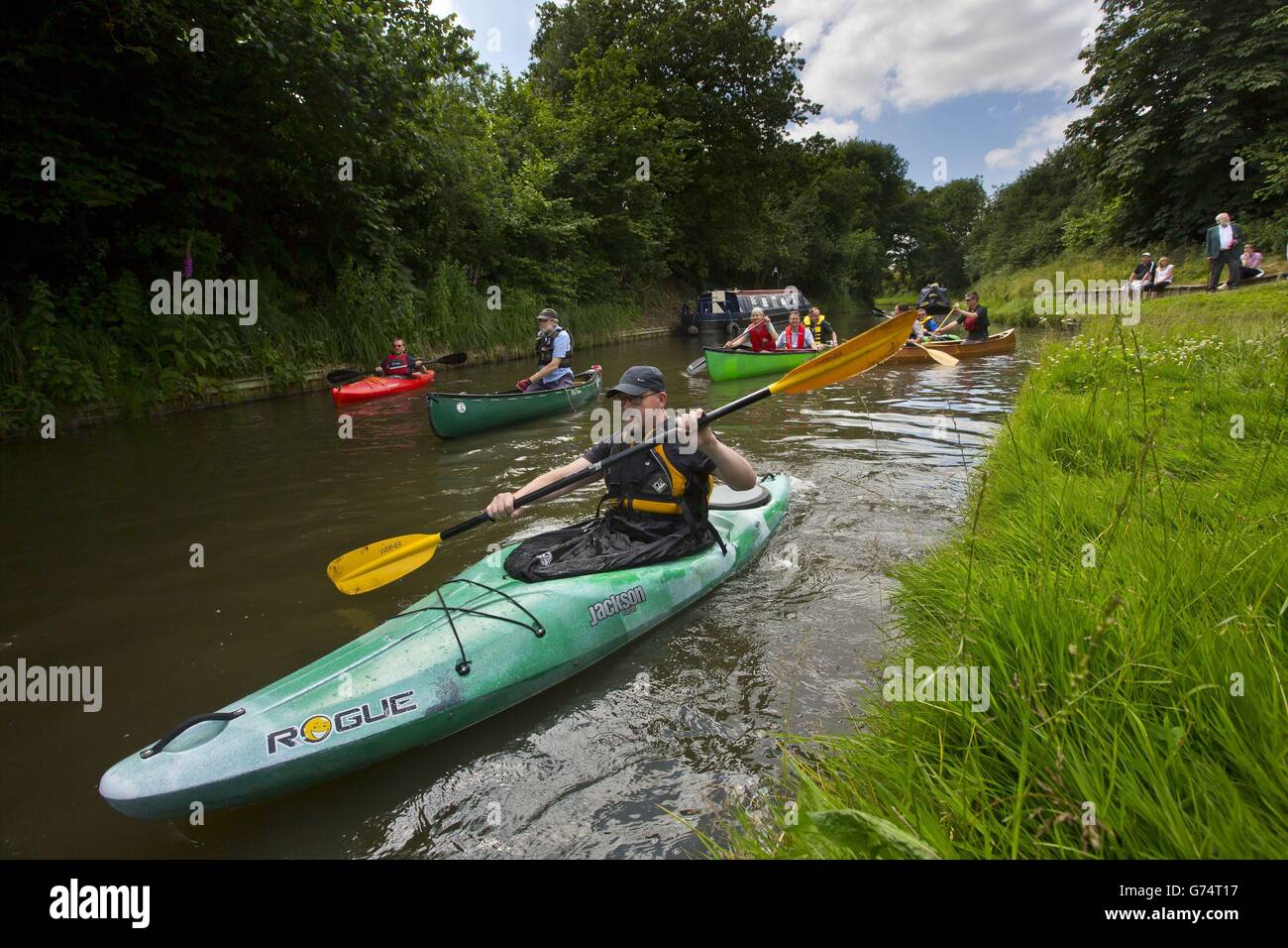 EDITORIAL USE ONLY Canoeists take part in an anniversary paddle along ...