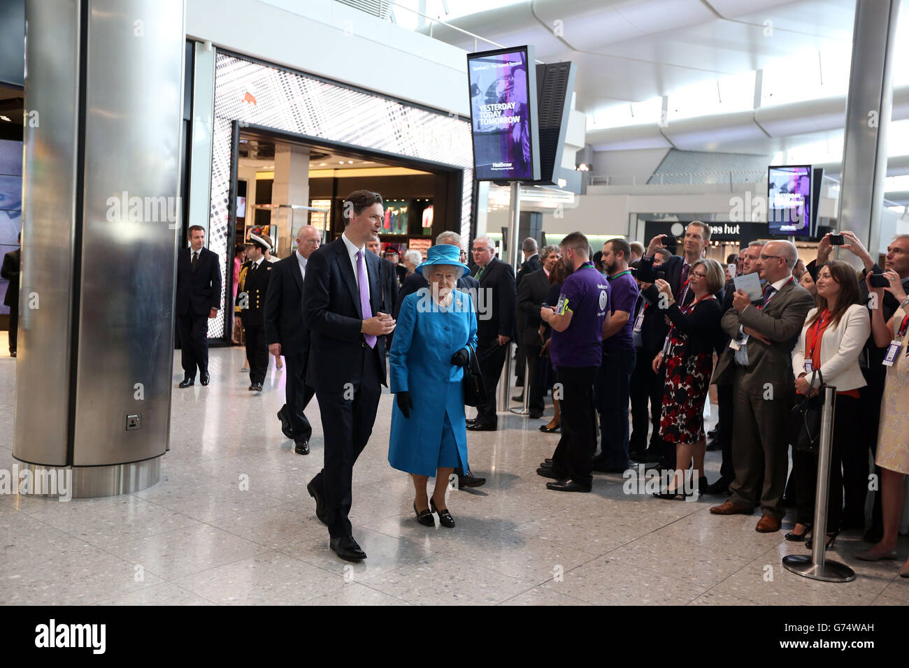 Queen Elizabeth II is shown around the new Terminal 2 The Queen's ...