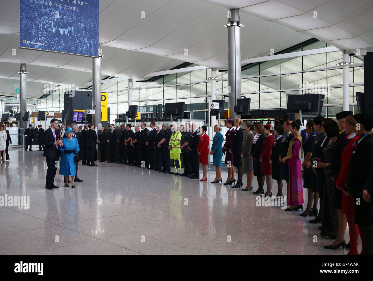 Queen Elizabeth II is shown around the new Terminal 2 The Queen's ...