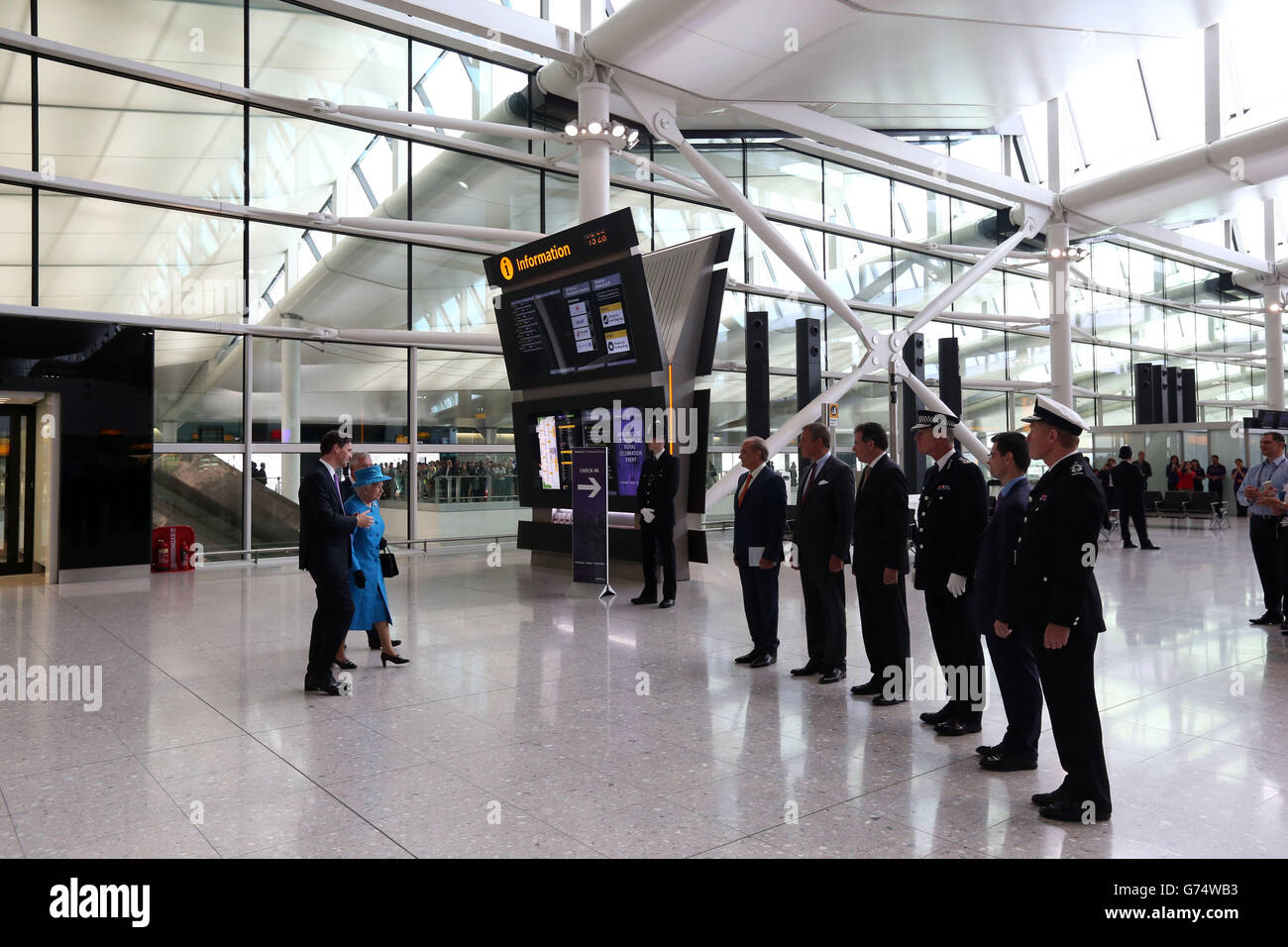 Queen Elizabeth II is shown around the new Terminal 2 The Queen's ...